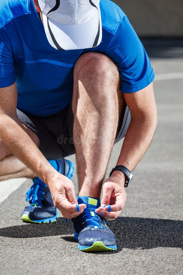 Runner Trying Running Shoes. Stock Photo - Image of road, hands: 40882270