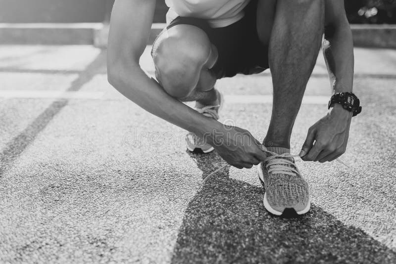 Runner Trying Running Shoes Getting Ready for Run. Black and White ...