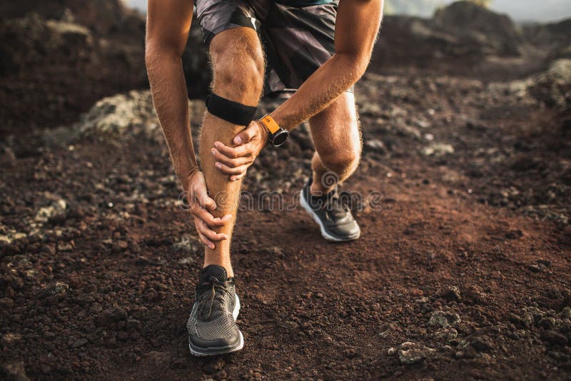 Runner Using Knee Support Bandage with Leg Injury Stock Image - Image ...