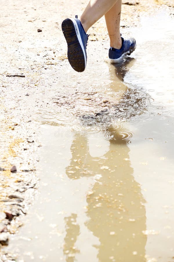 Runner on wet dirt path stock image. Image of lifestyle - 77474587