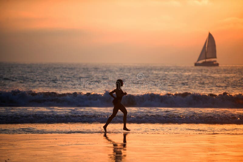 Runner Woman Running in the Beach at Sunset. Stock Image - Image of ...