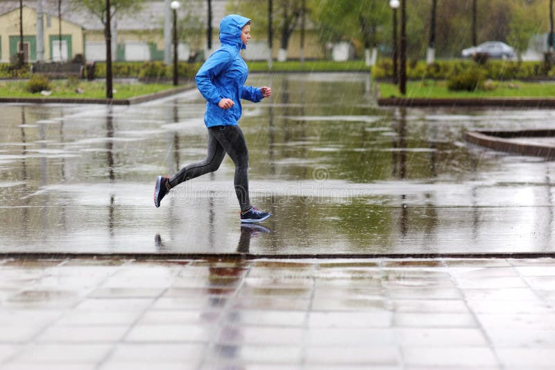 Runner Woman Running in Park in the Rain. Jogging Training for M Stock ...