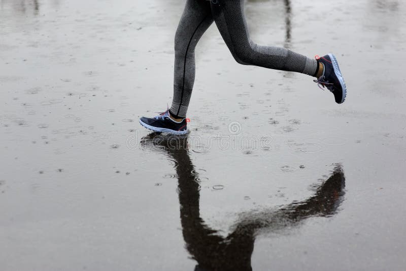 Runner Woman Running in Park in the Rain. Jogging Training for M Stock ...