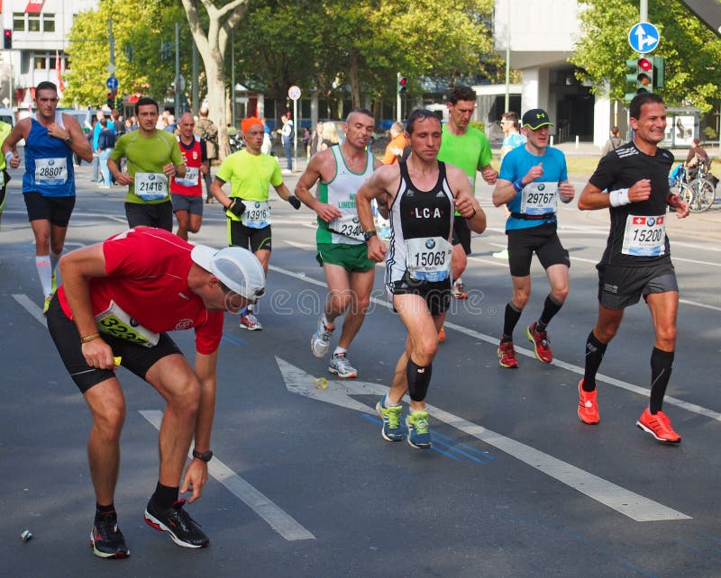 Runners, One of Them Standing, at Berlin Marathon 2014 Editorial Photo ...