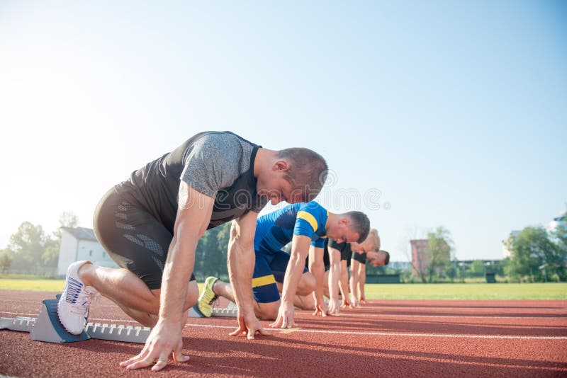 Runners Preparing for Race at Starting Blocks Stock Image - Image of ...