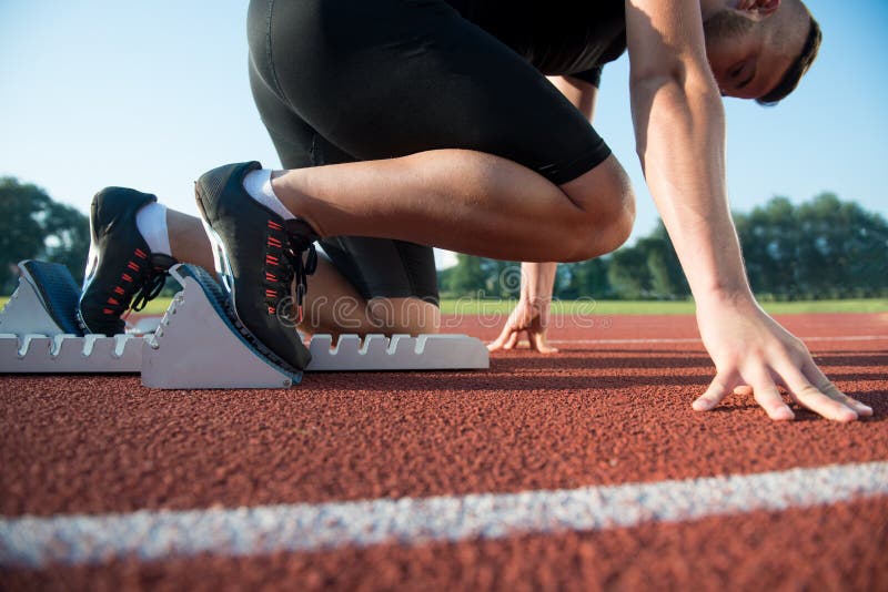 Runners Preparing for Race at Starting Blocks Stock Image - Image of ...