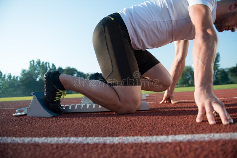 Runners Preparing for Race at Starting Blocks Stock Image - Image of ...