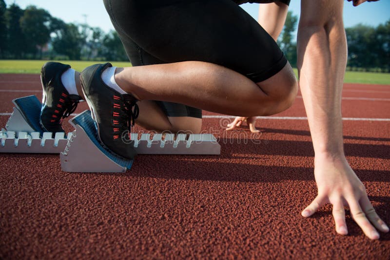 Runners Preparing for Race at Starting Blocks Stock Image - Image of ...