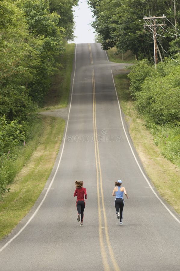 Runners on rural road stock image. Image of road, countryside - 6834697