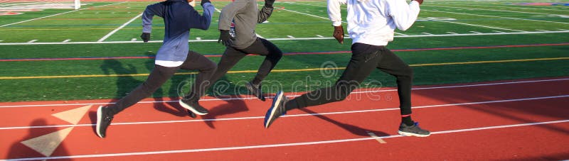 Runners Sprinting on a Track during an Athletic Practice Stock Image ...