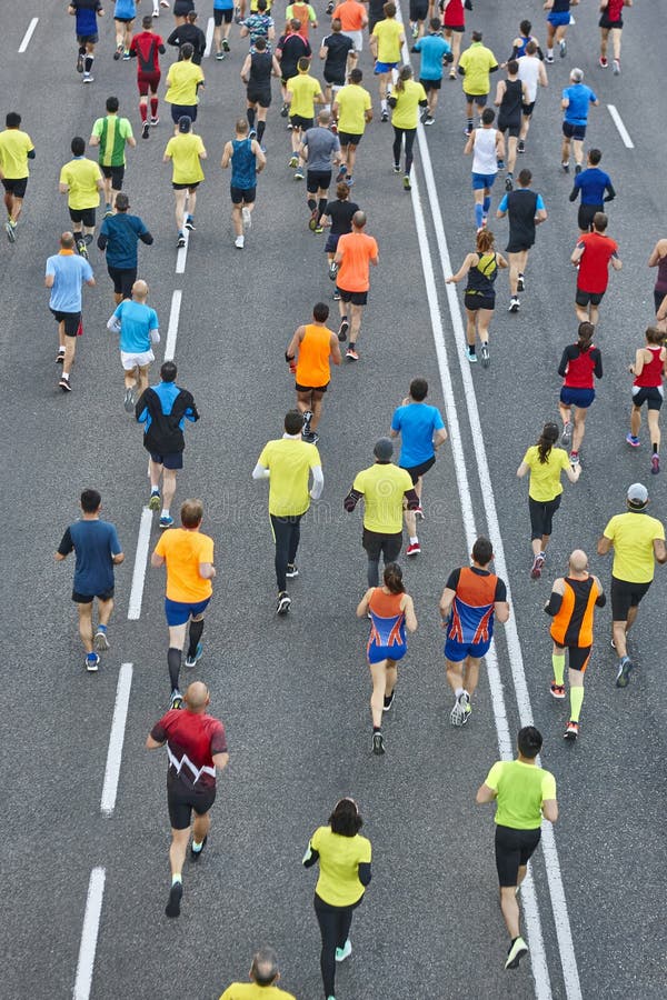 Runners on the Street. Athletes in Motion. Urban Competition. Crowd ...