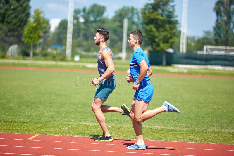 Runners on track stock photo. Image of outdoors, people - 65226778