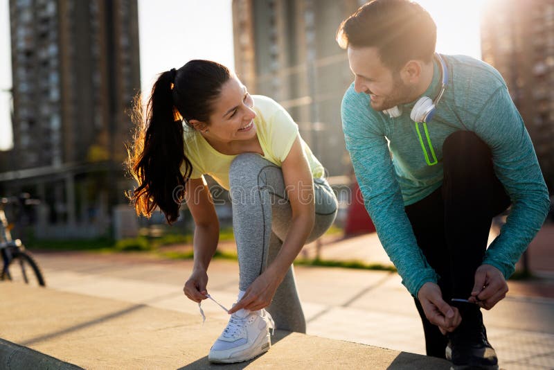 Runners Tying Running Shoes and Getting Ready To Run Stock Photo ...