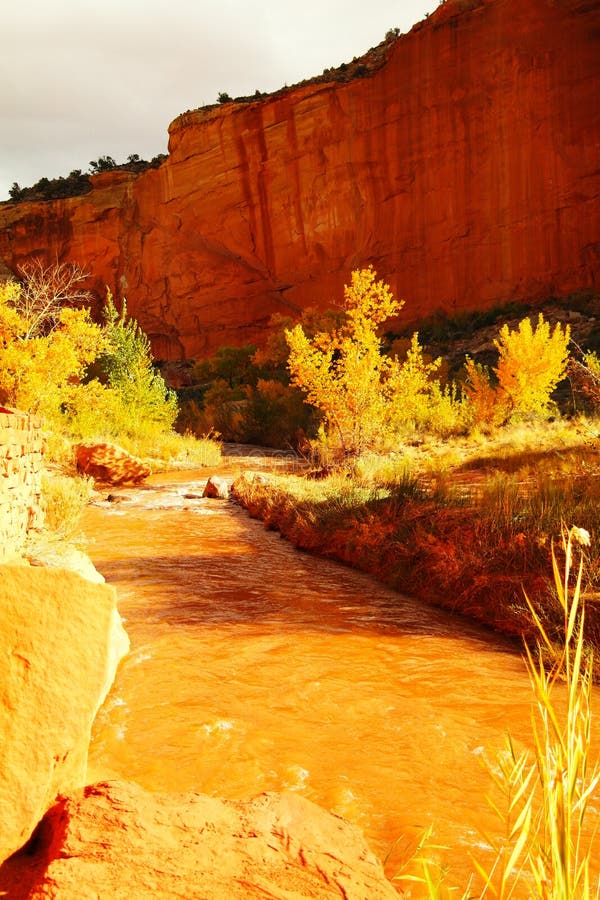 Runnig Water and Orange Cliffs Stock Photo - Image of plants, rocks ...
