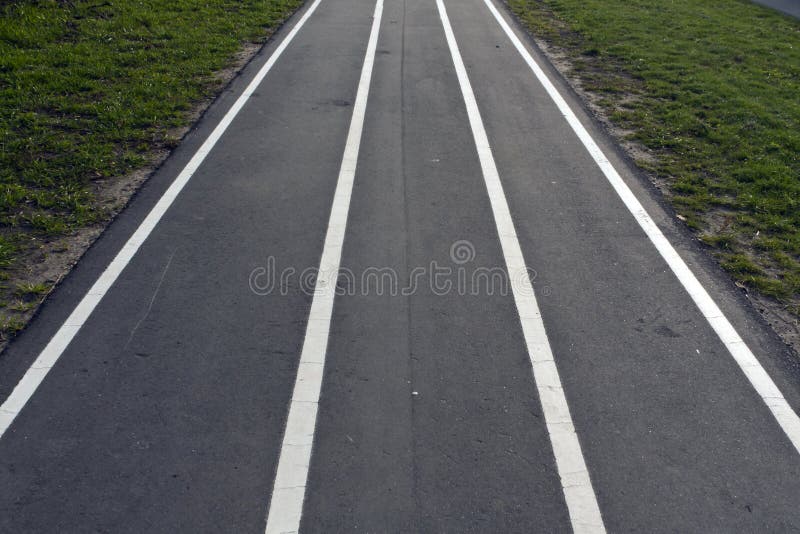 Running Asphalt Track with White Painted Lines. Stock Photo - Image of ...