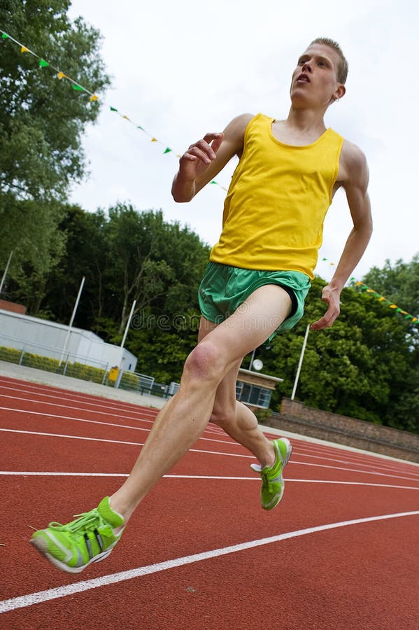 Running athlete in mid-air stock image. Image of athlete - 9693155