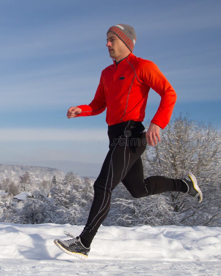 Running Athlete in the Snow Stock Photo - Image of contest, runner ...