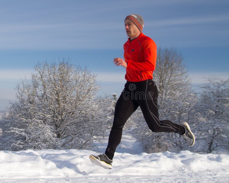 Running Athlete in the Snow Stock Photo - Image of challenge, lifestyle ...