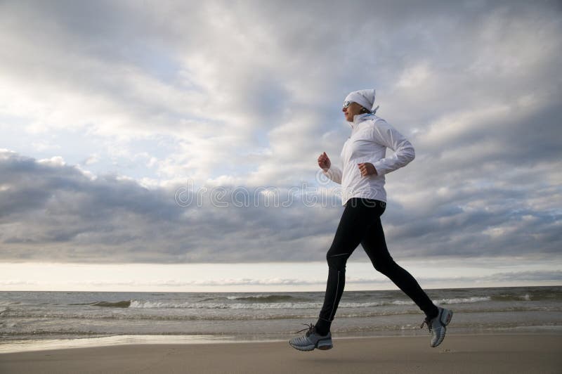 Female Runner Running at the Beach Jogging Stock Photo - Image of ...