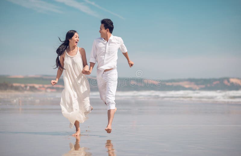 Running on beach stock image. Image of couple, expression - 46788499