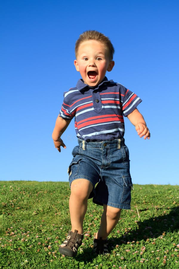Running boy stock photo. Image of leisure, grass, fast - 18030398