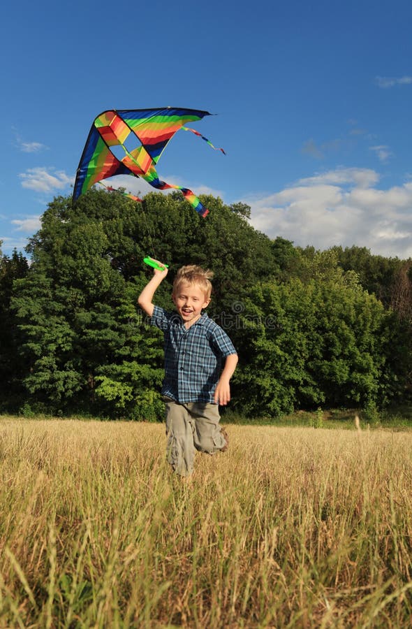 Running Boy with Flying Kite Stock Photo - Image of colourful, outdoor ...