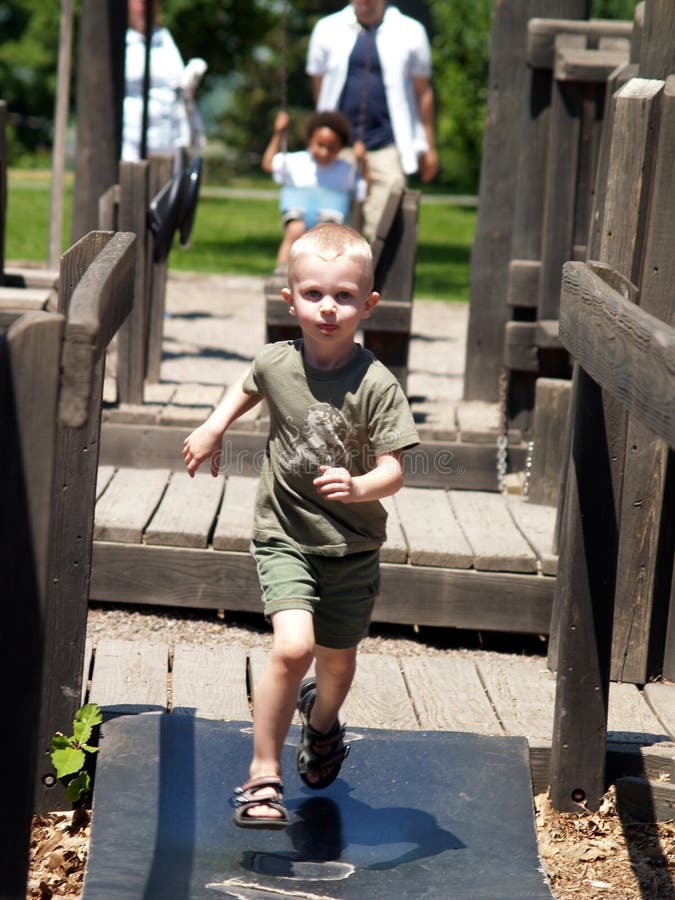 Running Boy on Playground 2 Stock Image - Image of sandals, short: 1354449