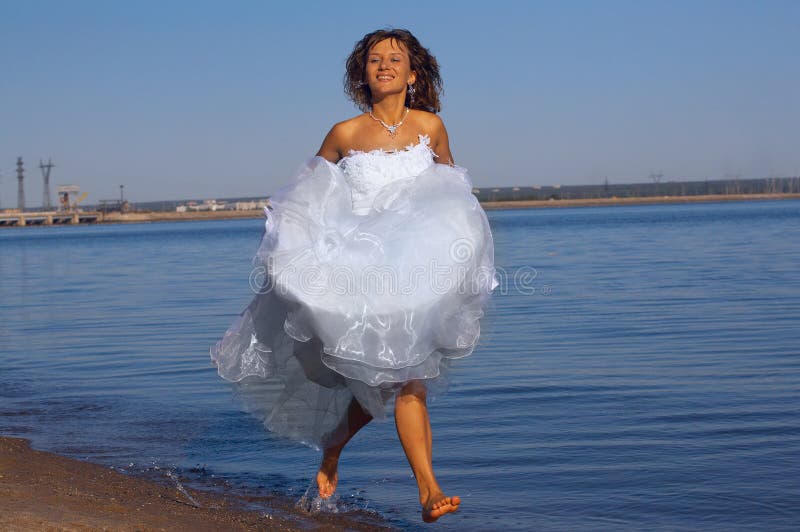 Running bride stock image. Image of water, dress, person - 13935567