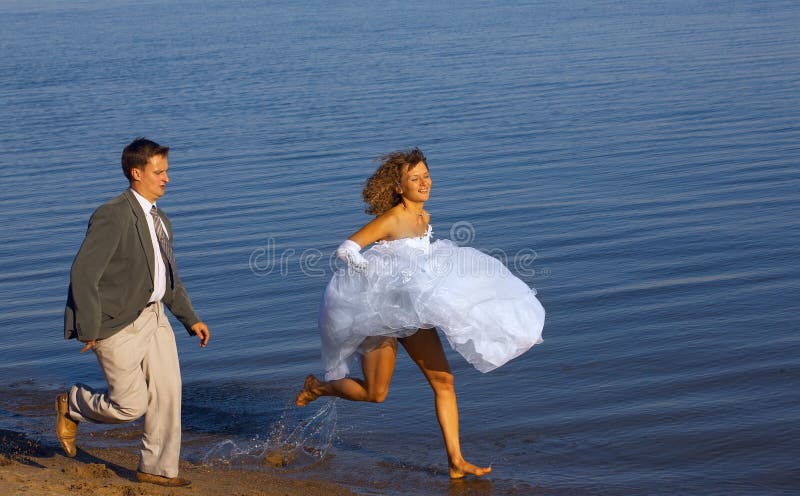 Running bride and fiance stock image. Image of fiance - 13285269