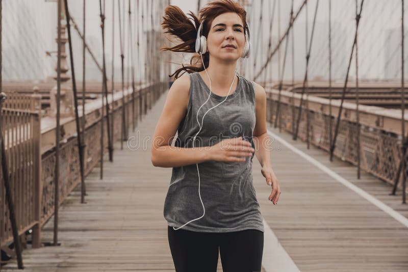 Running on Brooklyn bridge stock photo. Image of caucasian - 133258760
