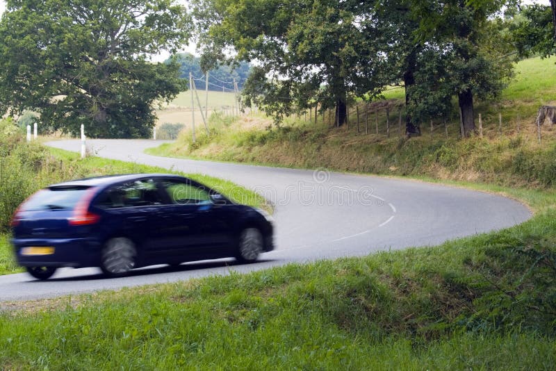 Fast Car Speeding on a Road with Real Motion Blur Stock Photo - Image ...