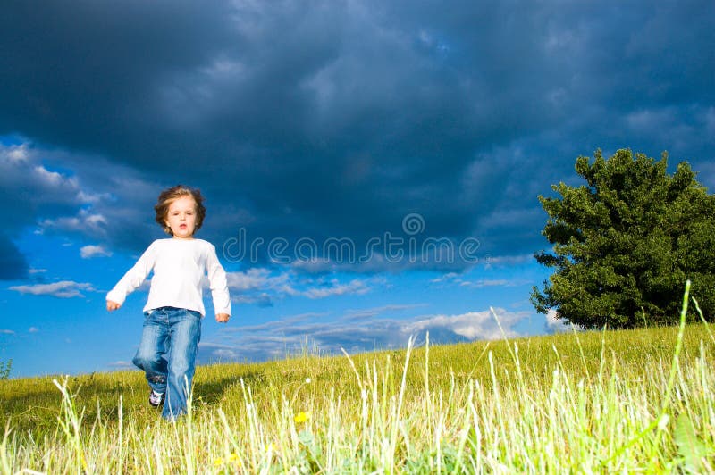 Running child stock image. Image of lawn, cloudscape, cheerful - 5536843