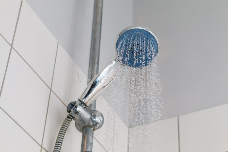 Running Cold Water from a Shower Head in a Bathroom. Stock Image ...