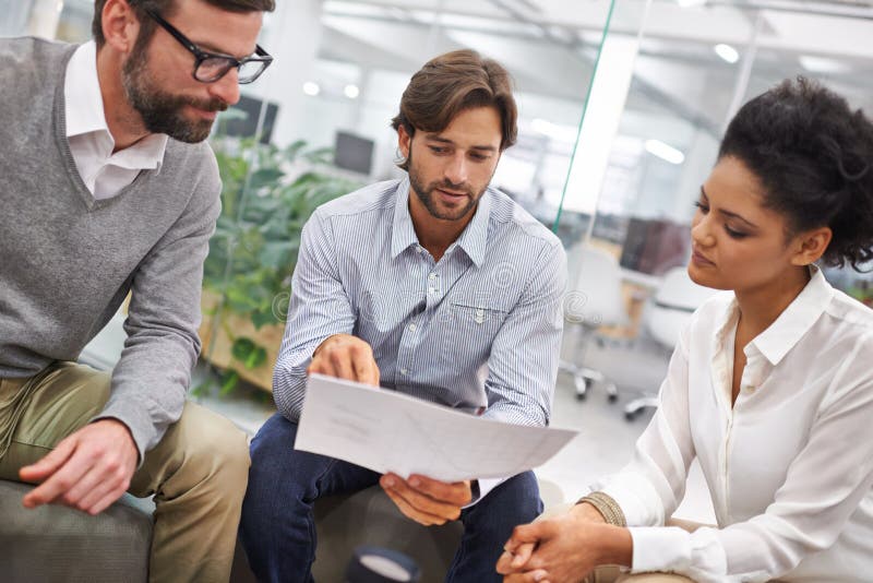 Running through the Contracts Details. a Group of Young Professionals ...