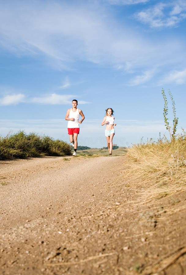 Running couple stock image. Image of road, blond, couple - 11821123