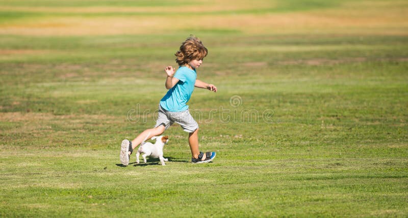 Running Dog. Happy Child Run with a Dog Outdoor. Stock Photo - Image of ...