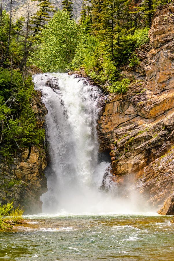 Portrait 0f Running Eagle Falls Raging with Snow Melt. Stock Image ...