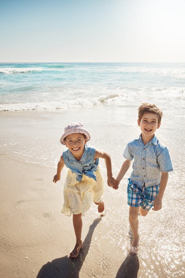 Running into a Fun-filled Day. Two Adorable Young Children Running Hand ...