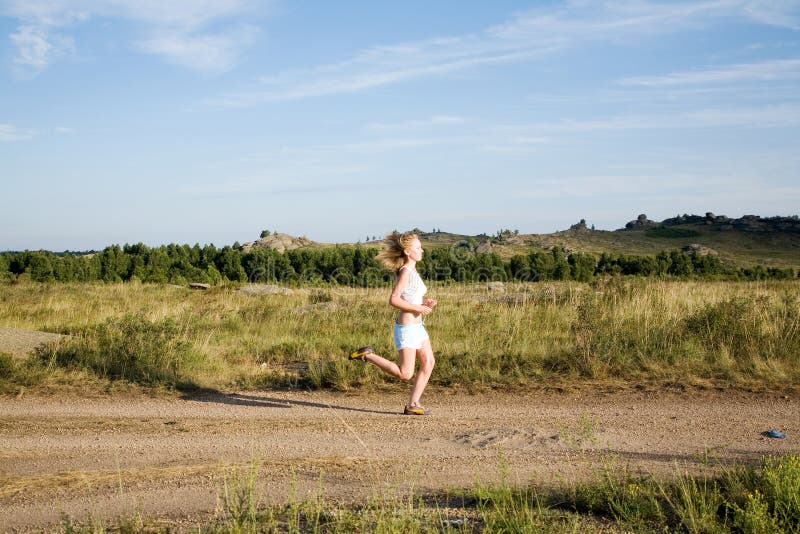 Running girl stock image. Image of cloud, athlete, caucasian - 12020129