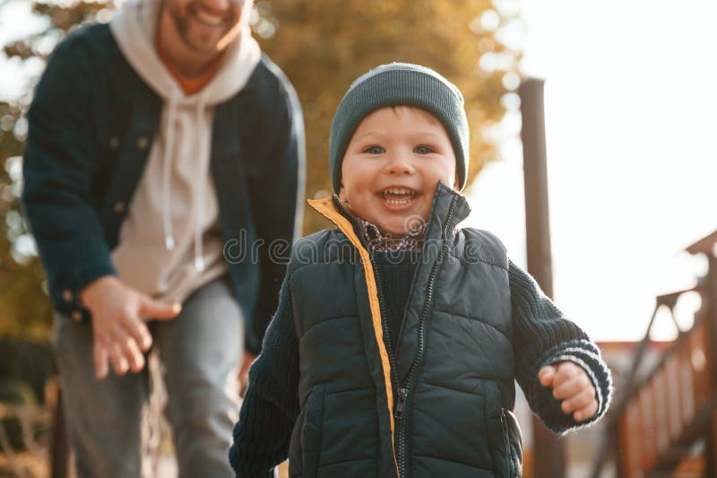 Running, Having Fun. Father and Young Son is Together Outdoors at ...