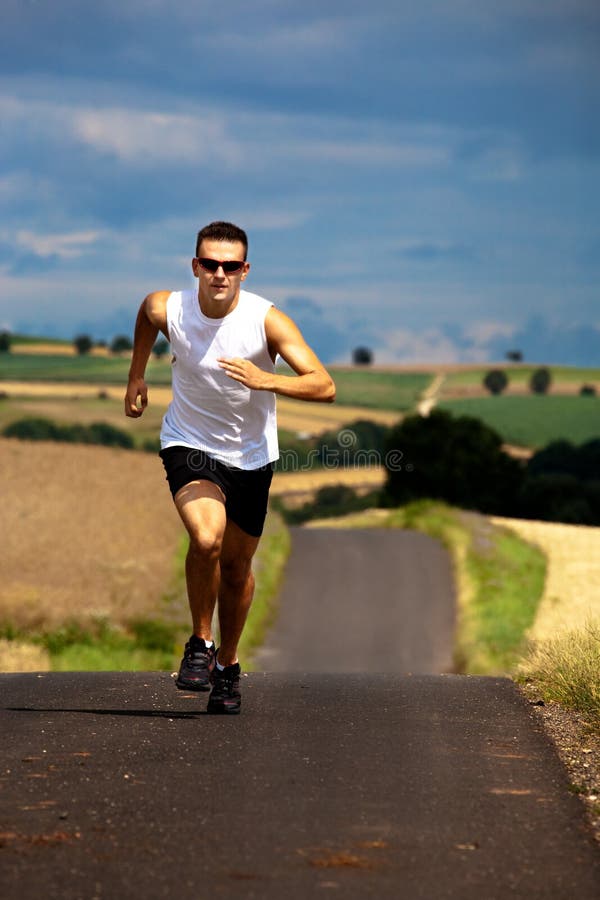 Running through the heat stock photo. Image of adult - 10295598