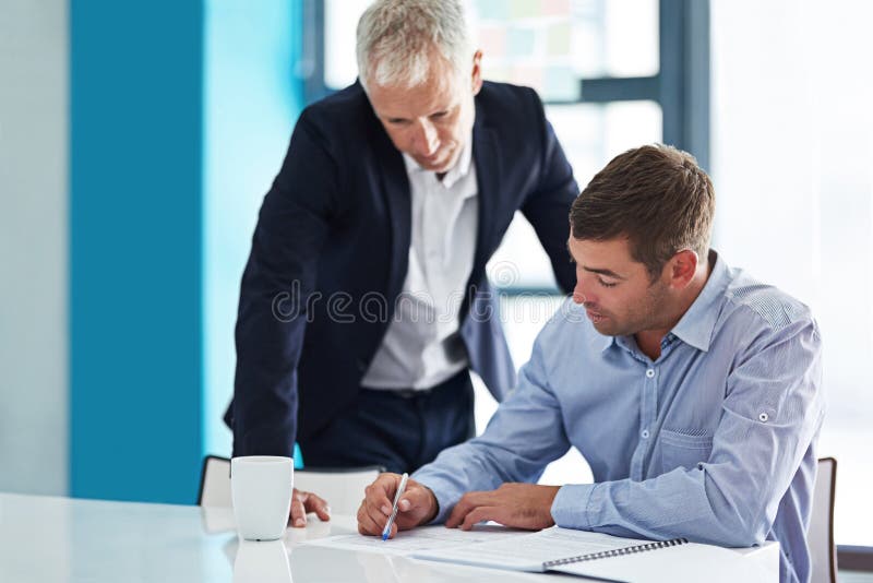 Running His Strategy by the Boss. Two Businessmen Working Together in ...