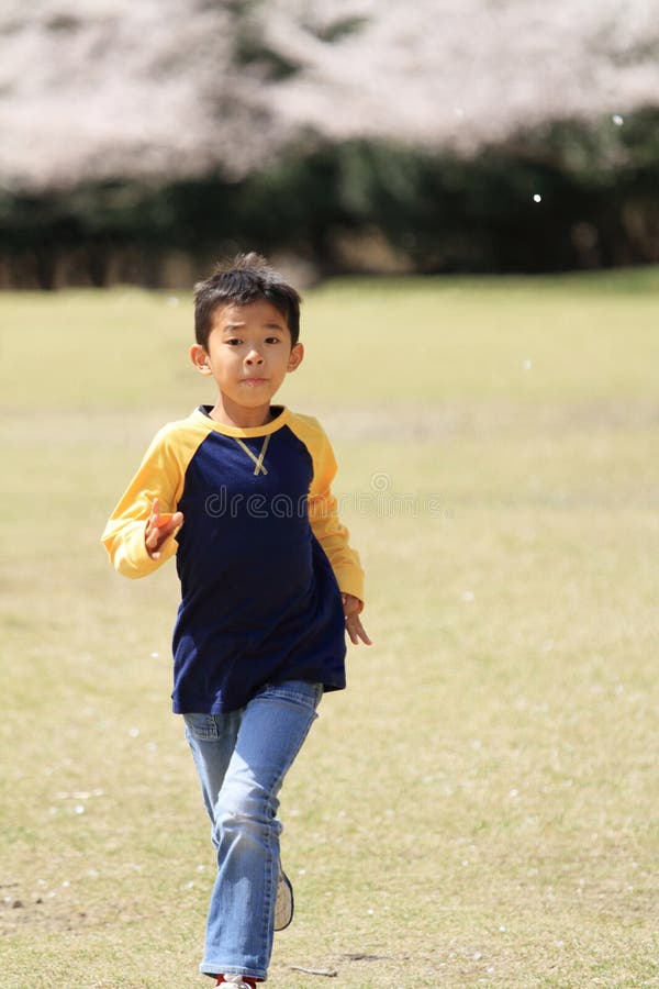 Running Japanese Boy and Cherry Blossoms Stock Photo - Image of outside ...