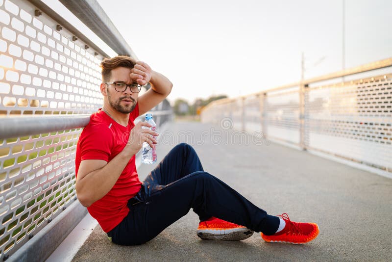 Running Male Adult Taking a Break. Tired Exhausted Man Runner Sweating ... Running Male Adult Taking a Break. Tired Exhausted Man Runner Sweating ...
