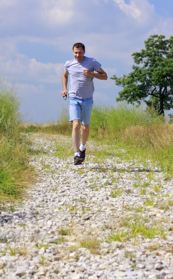 Running man stock image. Image of blue, path, fast, outdoors - 15284519