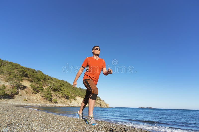 Running Man Along the Coast on a Sunny Day. Stock Photo - Image of ...