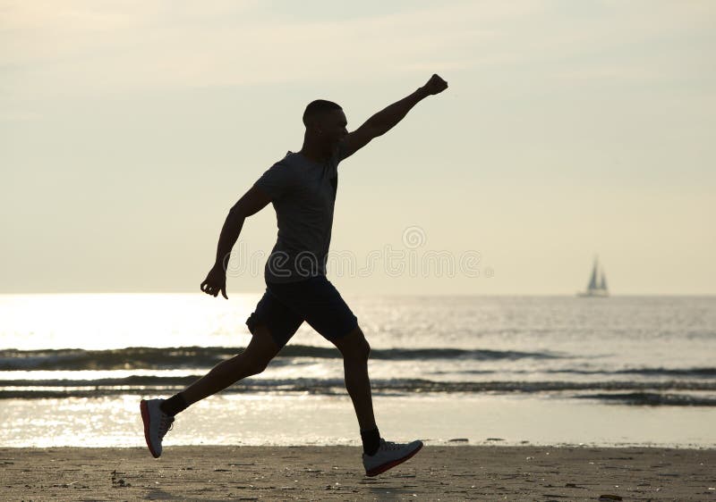 Running Man with Arm Raised in Celebration Stock Photo - Image of ...