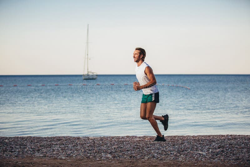 Running Man Jogging on Beach. Stock Image - Image of coast, active ...