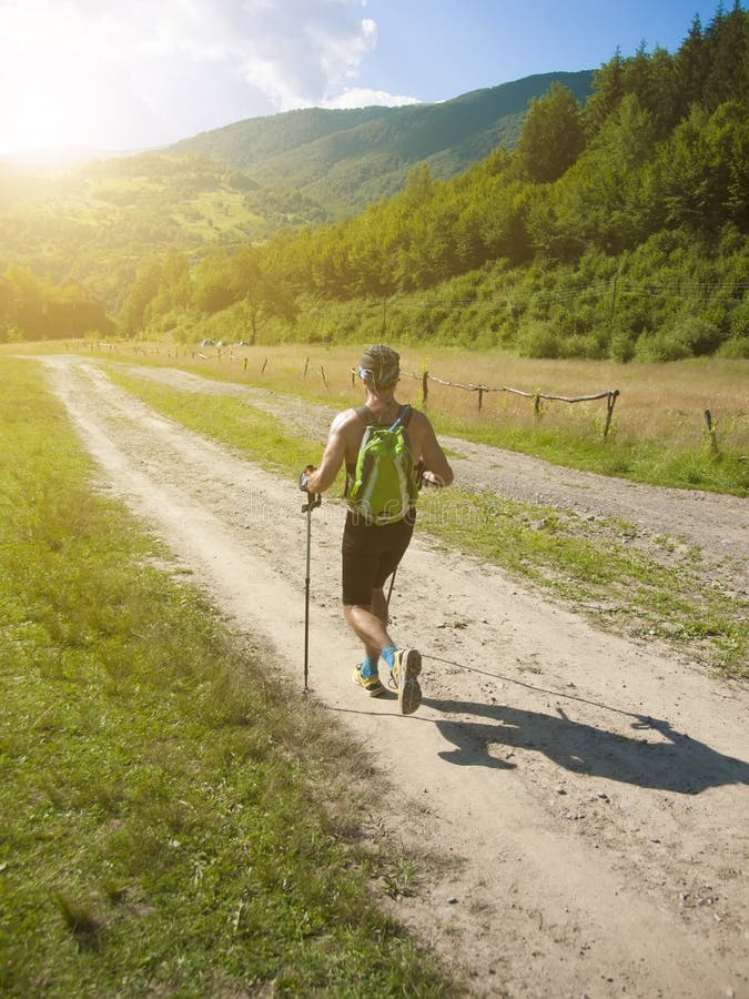 Running in the mountains. stock image. Image of downhill - 56551503