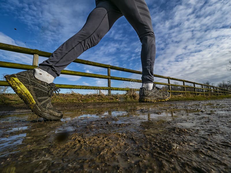 Running on a muddy trail stock photo. Image of muddy - 209216582